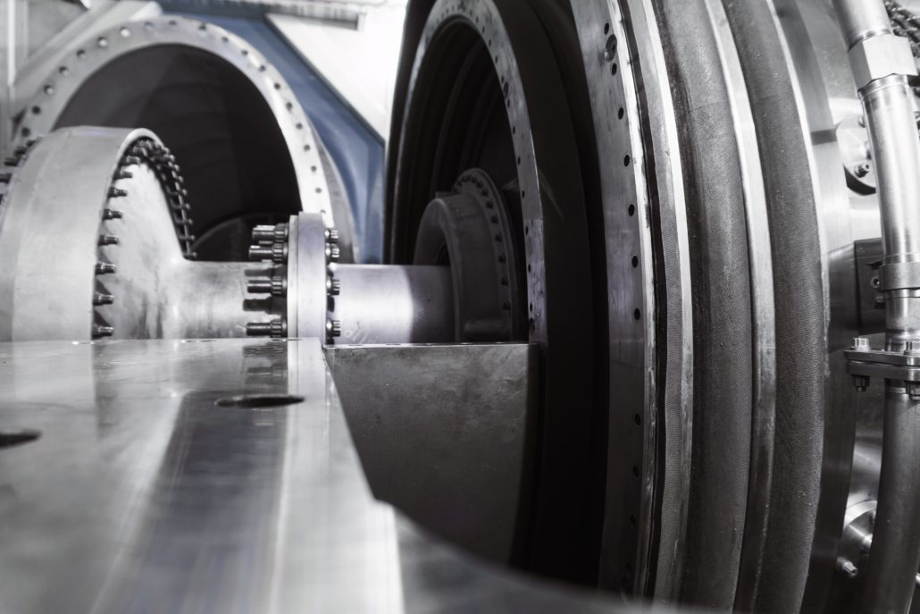 The rotor of a gas turbine compressor with a bolted coupling half ...